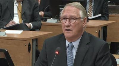 Above is an image of Jean Ouellette, mayor of Oka.