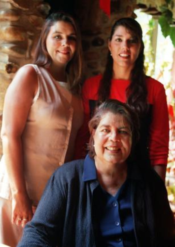This image shows Mankiller with her two daughters, Gina and Felicia Olaya.