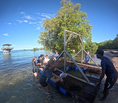 Moving the raft into the ocean on a challenge trip last year, to then ...