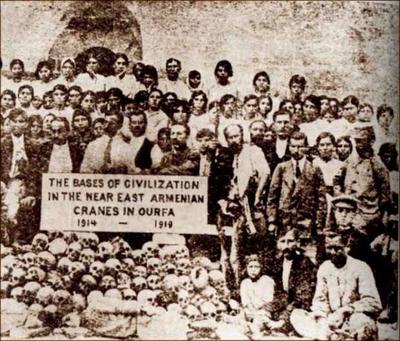 Armenians standing next to human remains that are near their house.