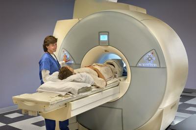 This is a picture of the MRI being used and how it works and how much ...