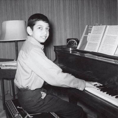 Young Jeff Goldblum with piano.