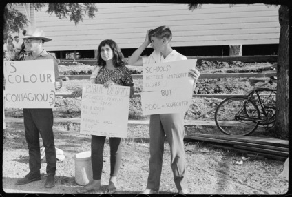 Protestors holding signs