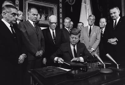 October 7, 1963 - President Kennedy signs the Partial Test Ban Treaty ...