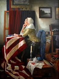 This is an image of a woman sewing an American flag.