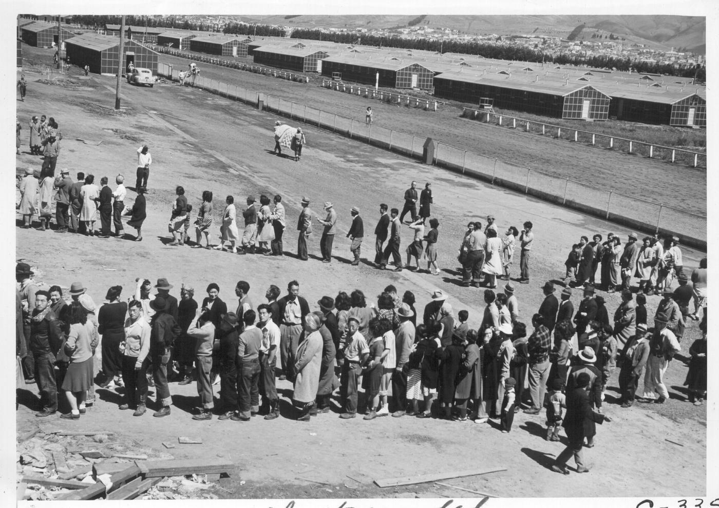 Japanese Americans all heading to go to internment camps.