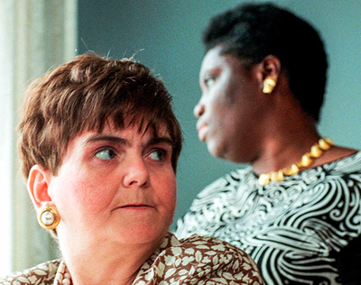 Image description: Two women, one in the foreground and the other in ...