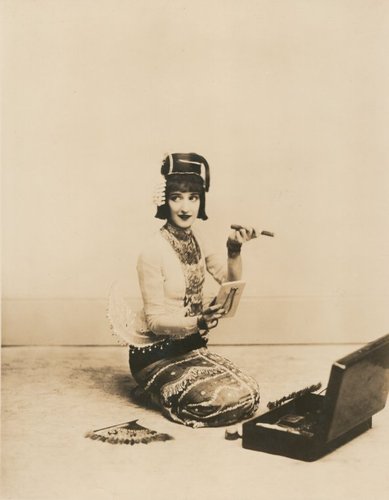 Doris Humphrey in oriental costume holding a cigar