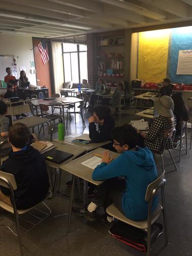 Students listen as classmates give presentations in a humanities class ...