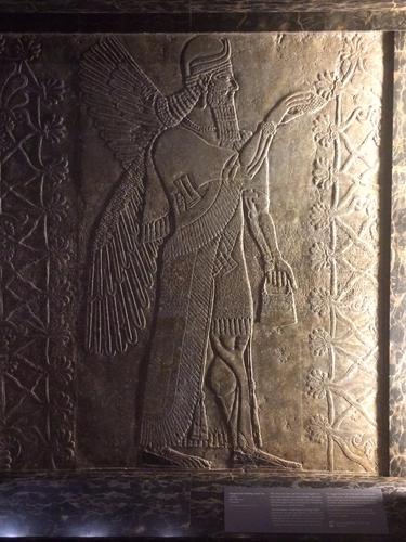 Winged Genie Fertilizing a Date Tree