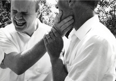 A picture of two people using the Tadoma method at Perkins school ...